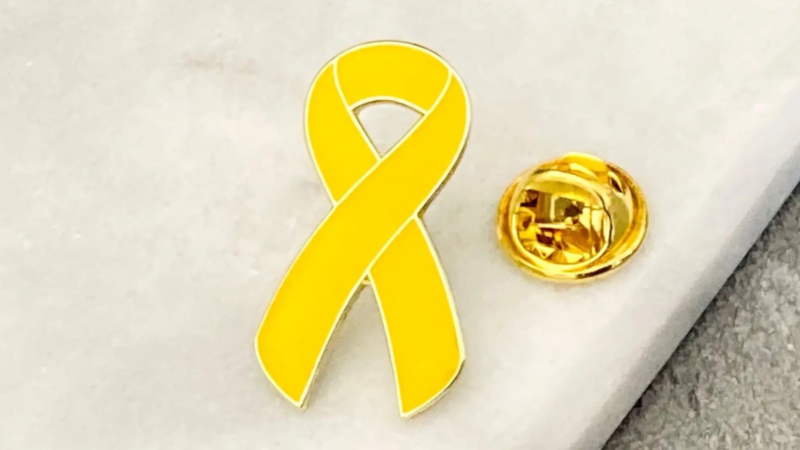 Yellow Ribbon Lapel Pin: Meaning, Symbolism, and Awareness